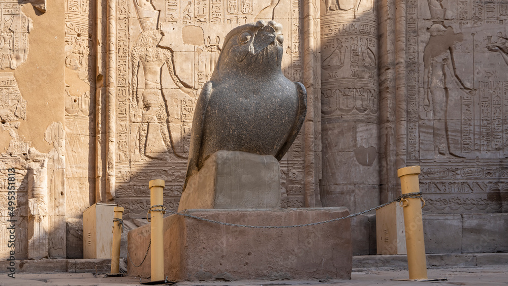 Granite sculpture of a falcon in the ancient temple of Horus in Edfu ...