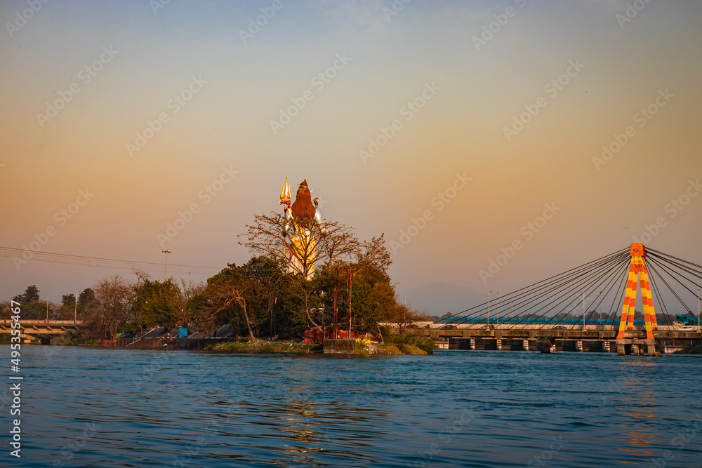 hindu god shiva statue and isolated cable bridge over ganges river from ...