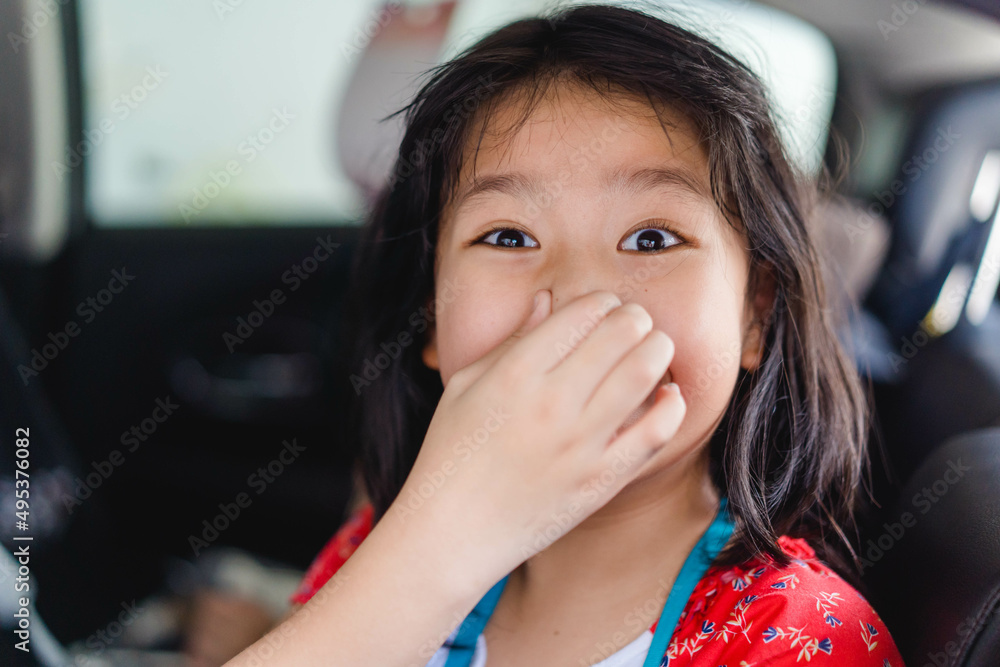 Asian kid girl covers her nose because of her sibling farting make a ...
