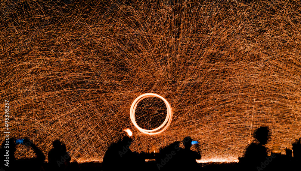 Fire dancers show Swing dancing show fire with flame show on the beach ...