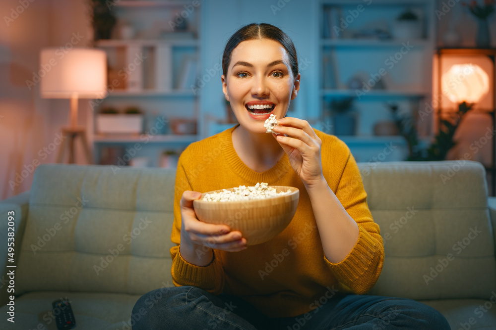 woman watching projector Stock Photo | Adobe Stock