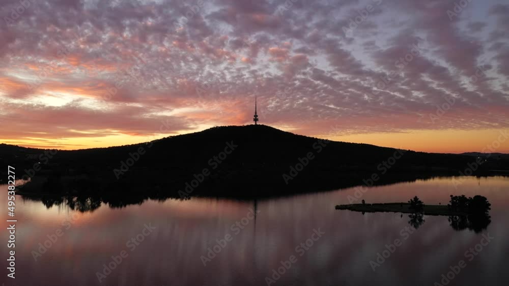 Canberra sunset silhouette aerial over Lake Burley Griffin, with ...