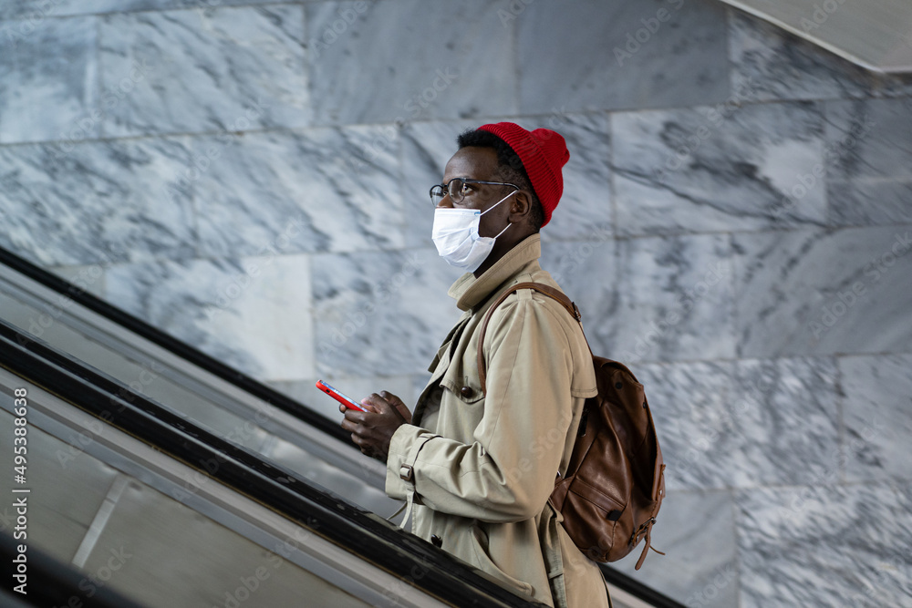 Serious African American young guy wear face mask for prevent ...