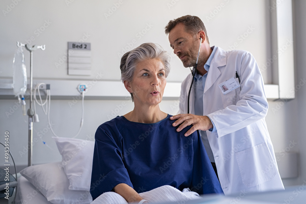 Doctor checking lungs of elder patient with stethoscope Stock Photo ...