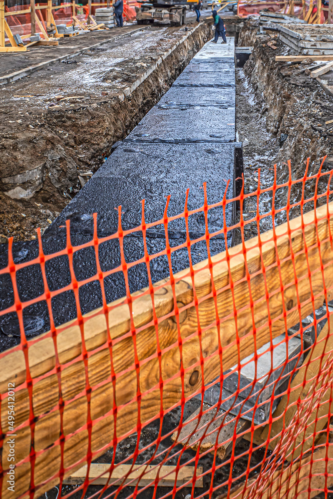 Installation of an underground heating system on a construction site ...