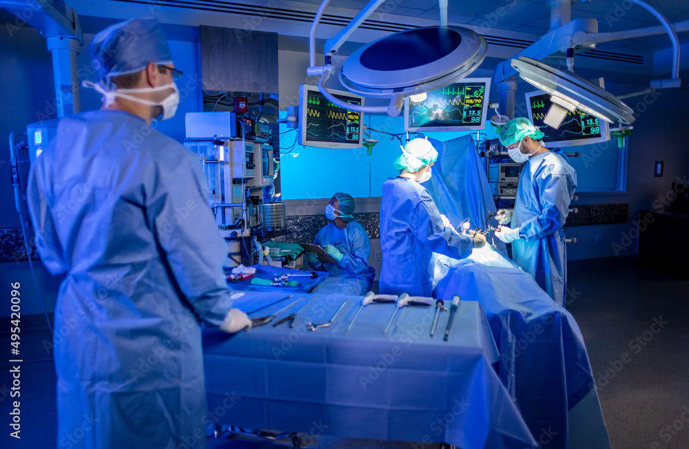 Photo & Art Print Hospital Operating Theatre medical team performing ...