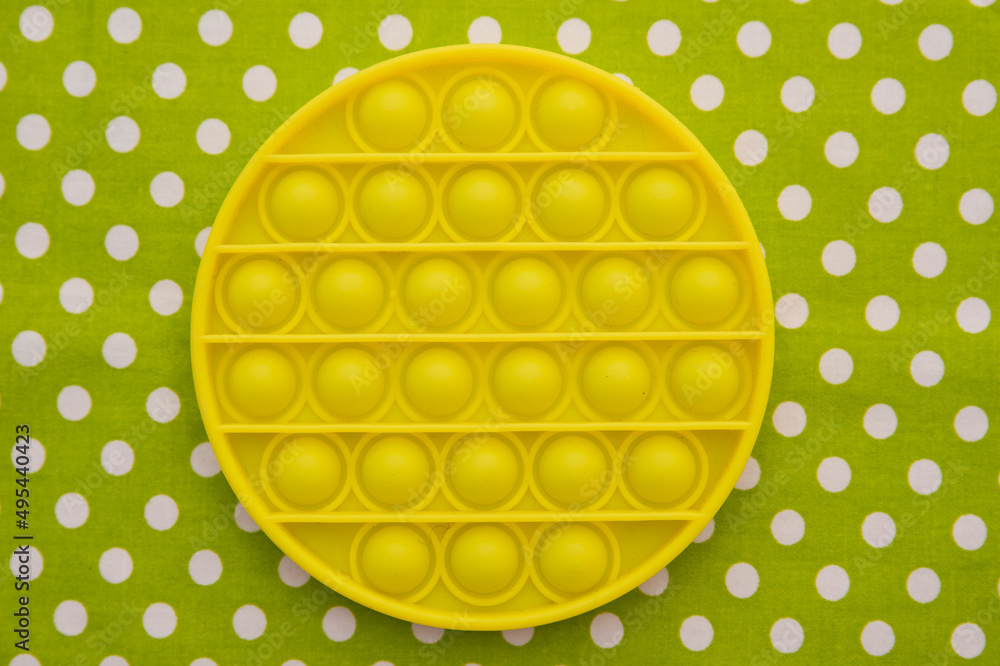 Sensory fidget toy "Pop-it". Instrument for fine motoric skils, tool to ...