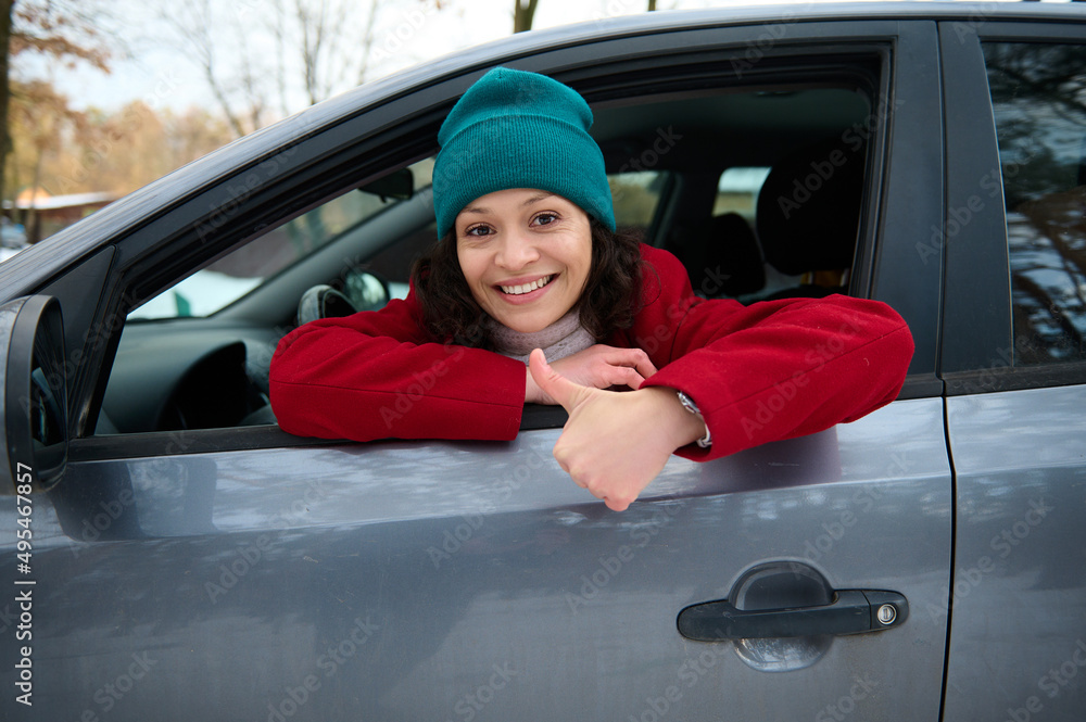 Cheerful gorgeous Caucasian woman driver traveler travelling by car ...