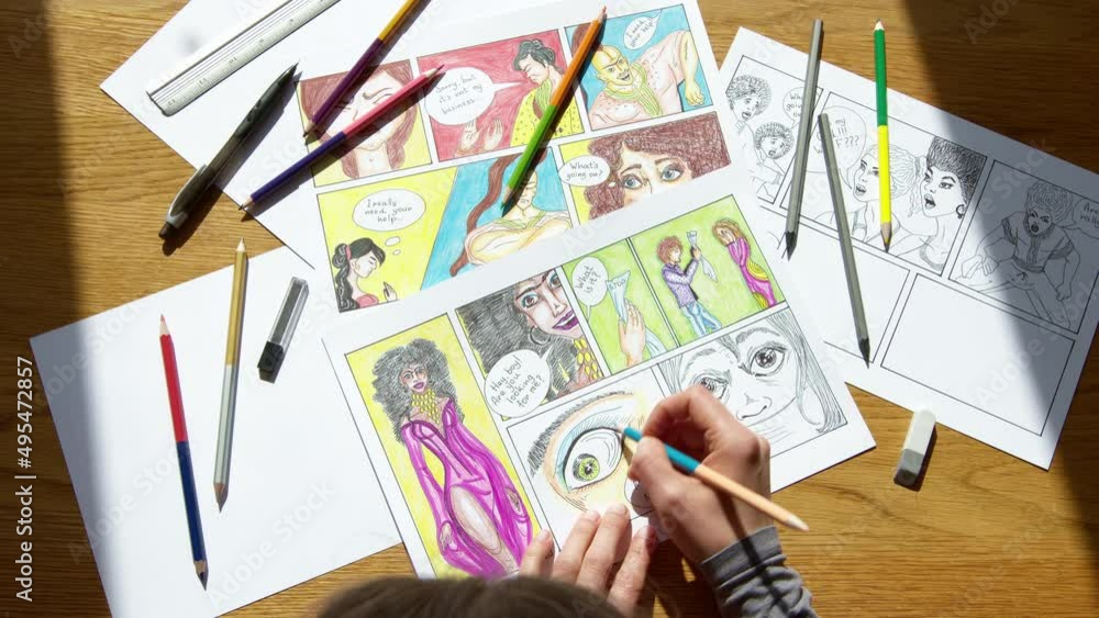 The artist draws comic book characters on paper. Illustrated drawings ...