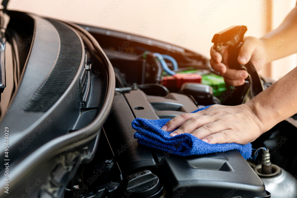 Car clean concept, Hand a man holding microfiber and spray cleaner ...