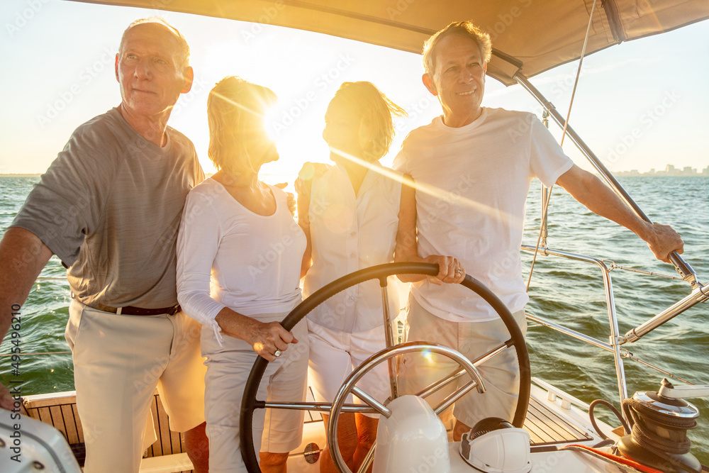Retired couples with lifelong friendship sailing private yacht Stock ...