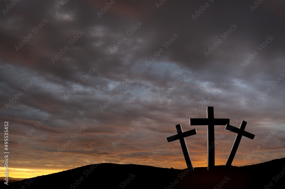 Crucifixion and resurrection, crosses against the sunset background ...