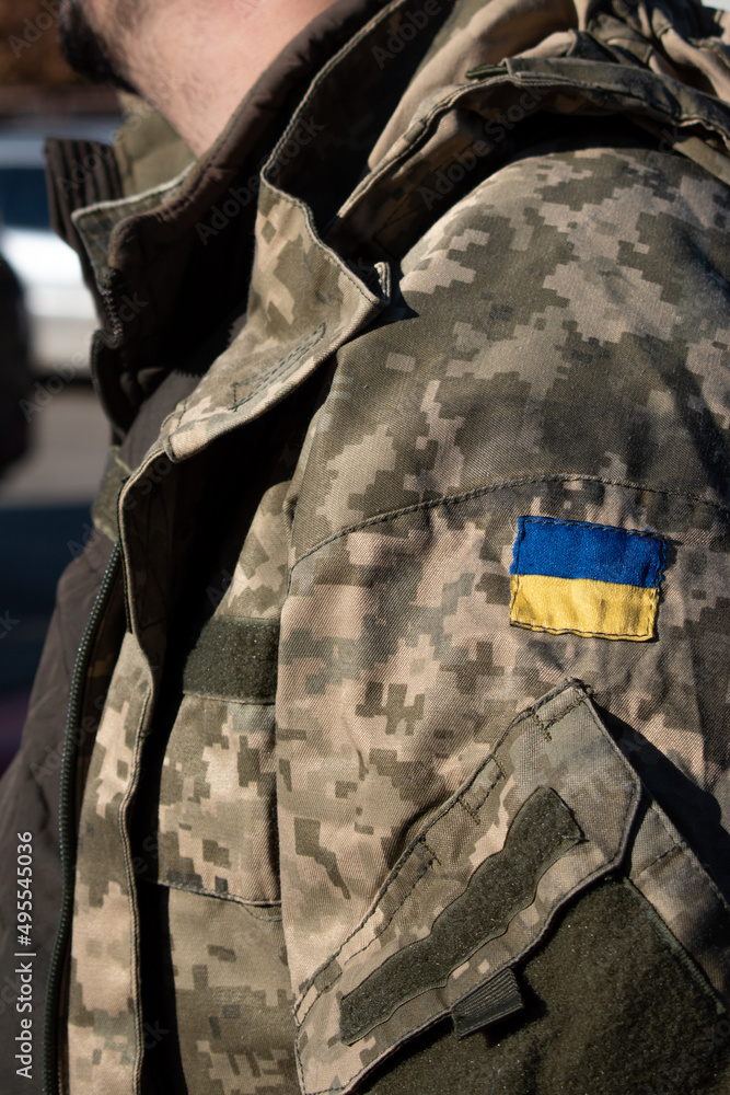 Ukrainian flag on the uniform of a military soldier. Symbol of the ...