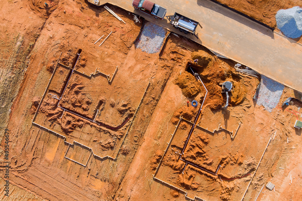Laying pipes in the ground the excavated soil during construction land ...