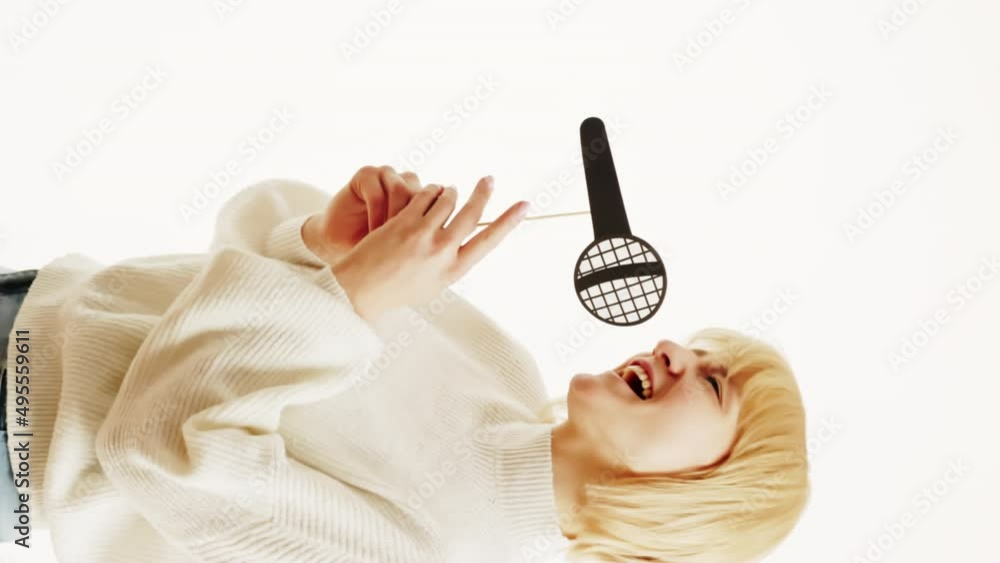 Person singing into a Paper Microphone, Singer Holding a Fake Mic on a ...