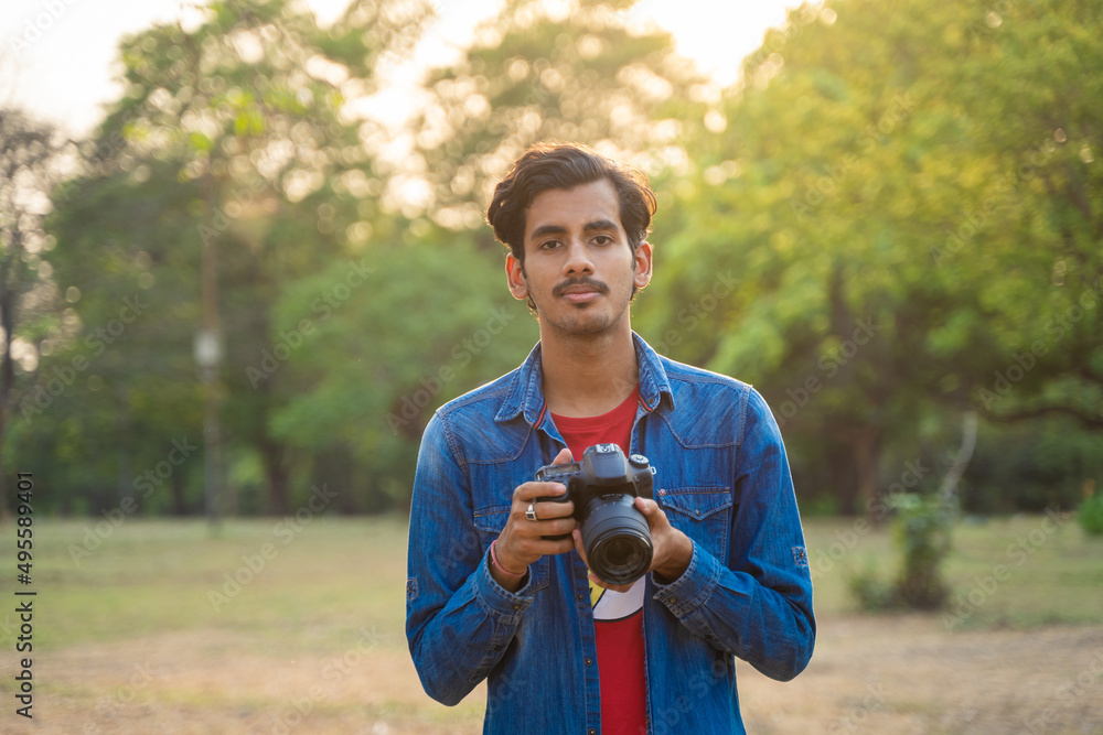 Young Indian photographer with his professional camera Stock Photo ...