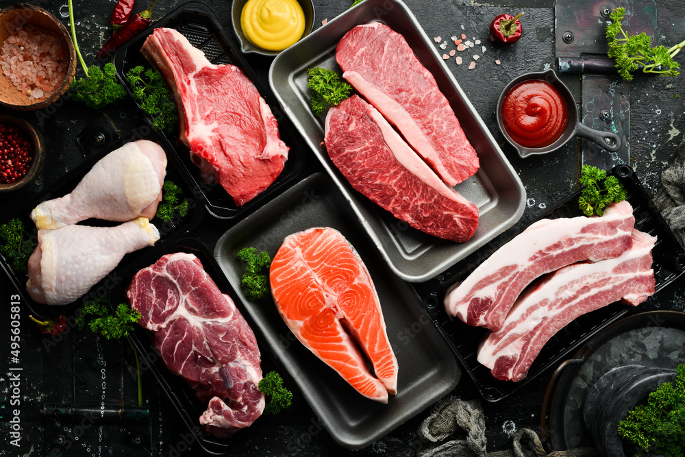 Zdjęcie Stock: Set of fresh raw meat and fish in plastic boxes: veal ...