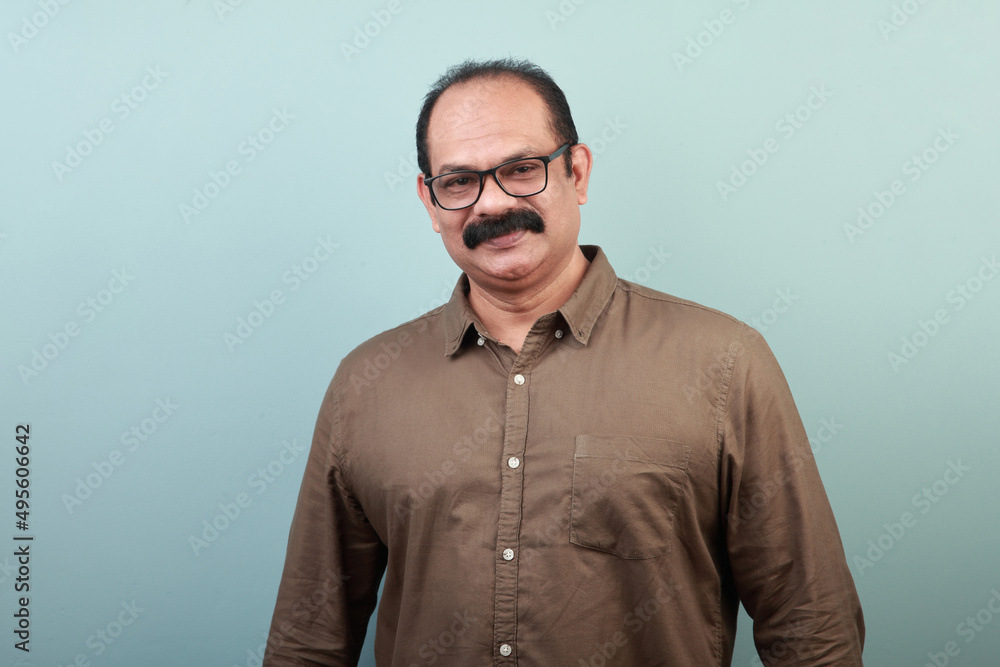 Portrait of a middle aged man of Indian ethnicity Stock Photo | Adobe Stock