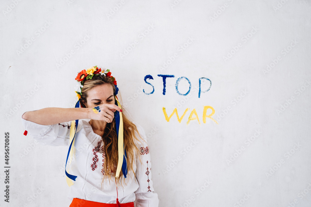 Ukrainian girl sad crying war in Ukraine. Stop war. Stock Photo | Adobe ...