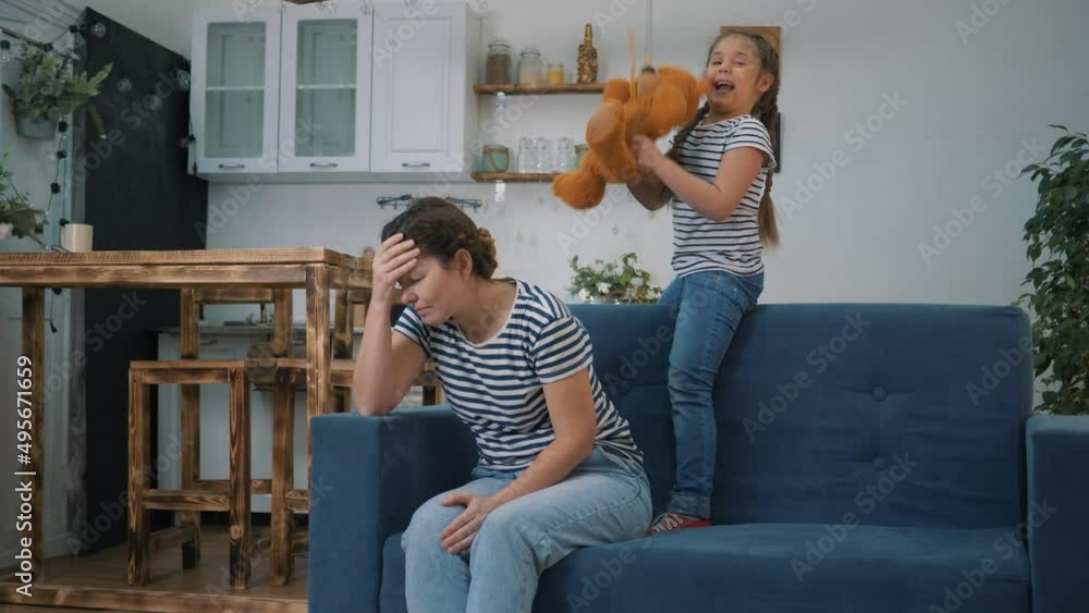 Vídeo do Stock: Irritated girl with sore head. Daughter screams and ...