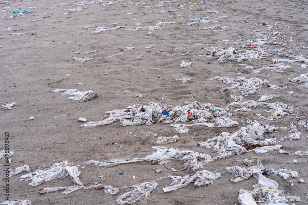 Beach full of garbage, wet wipes and waste that people throw in the ...