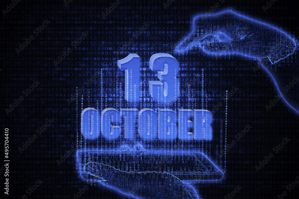 October 13th. A hand holding a phone with a calendar date on a ...