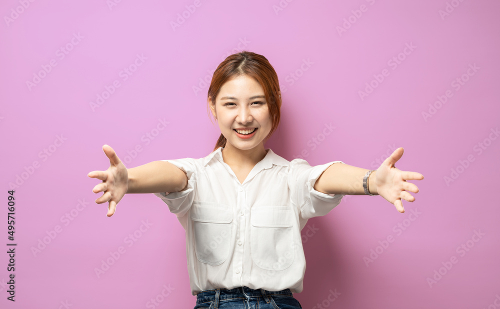 Welcome. Hostile happy girl extends hands in warm welcome, smiling and ...