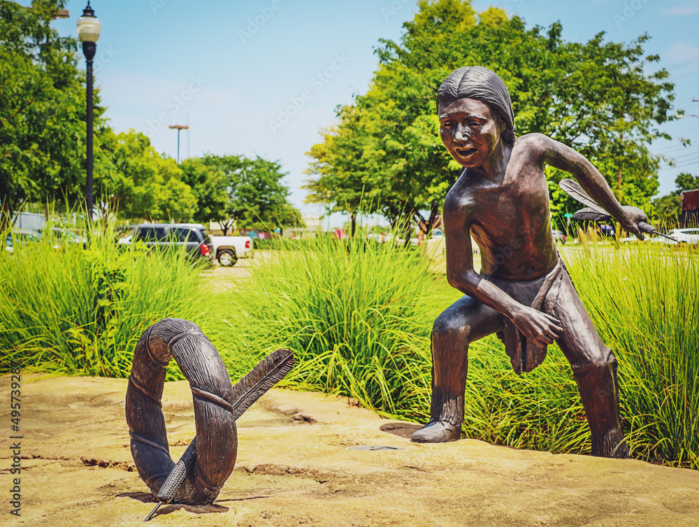 2021_07_20 Tulsa OK USA - Bronze statue of native American boy playing ...