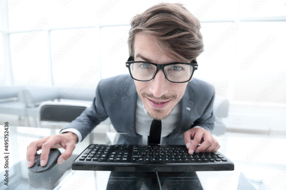 Crazy looking man typing on the keyboard Stock Photo | Adobe Stock