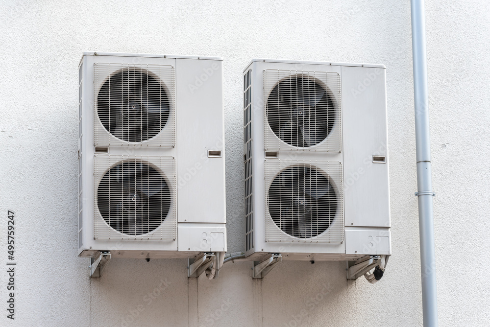 Air conditioner compressor outdoor unit installed outside the building ...