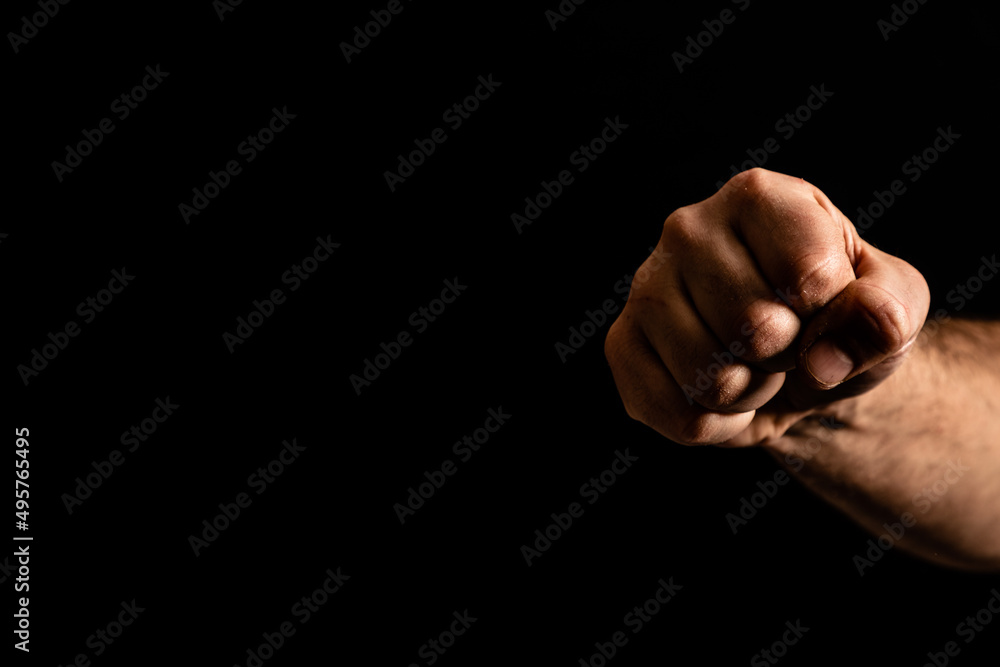 Clenched fist throwing a punch and hitting towards viewer. Stock Photo ...
