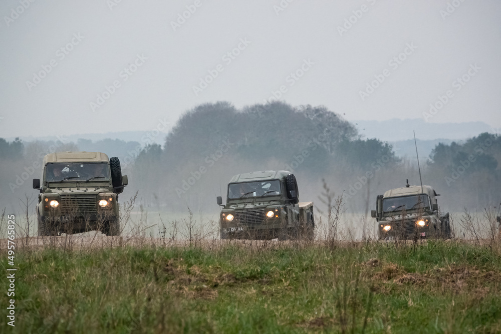 a small convoy British Army Land Rover Defender Wolf medium utility ...
