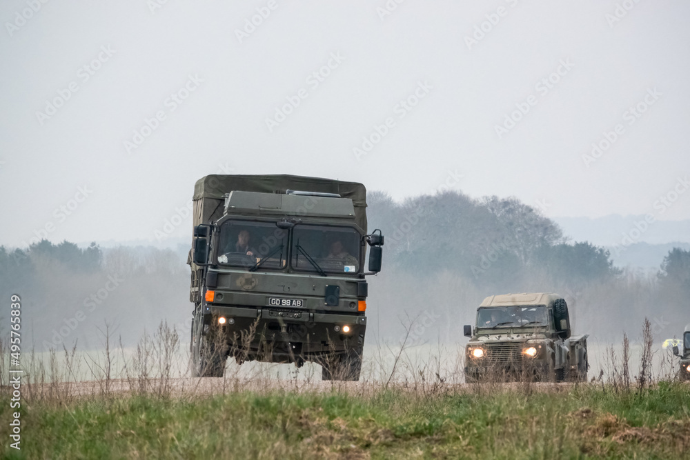 a small convoy British Army Land Rover Defender Wolf medium utility ...