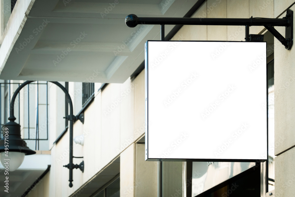 Mock up. Empty white rectangular signage on the wall of classical ...