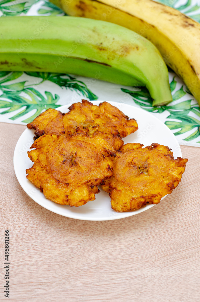 Patacones or fried tostones of green or ripe plantain, with a crispy ...