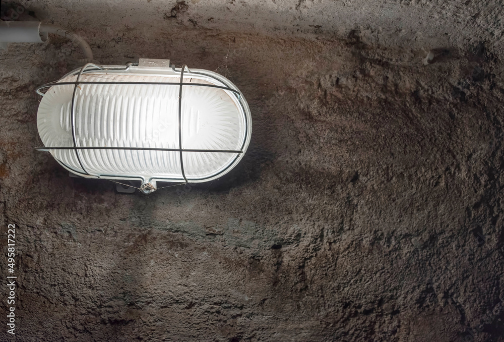 Concrete wall under Industrial old ceiling lamp light. Old vintage ...