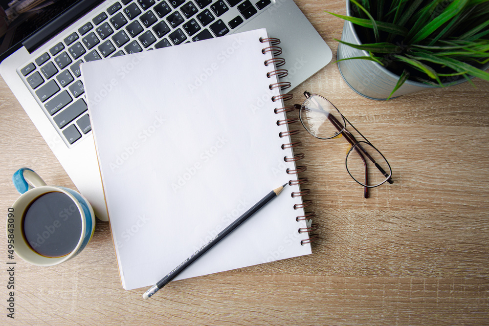 Office wooden desk table with laptop, supplies and tablet . Top view ...