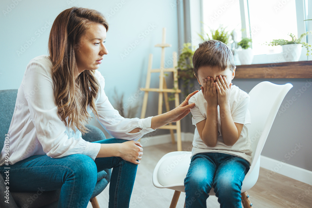 Children need help. Upset little boy crying in psychologist's office ...