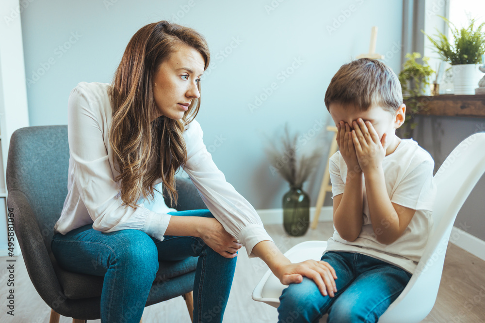 Parenthood and child development, young worried mother comforting ...