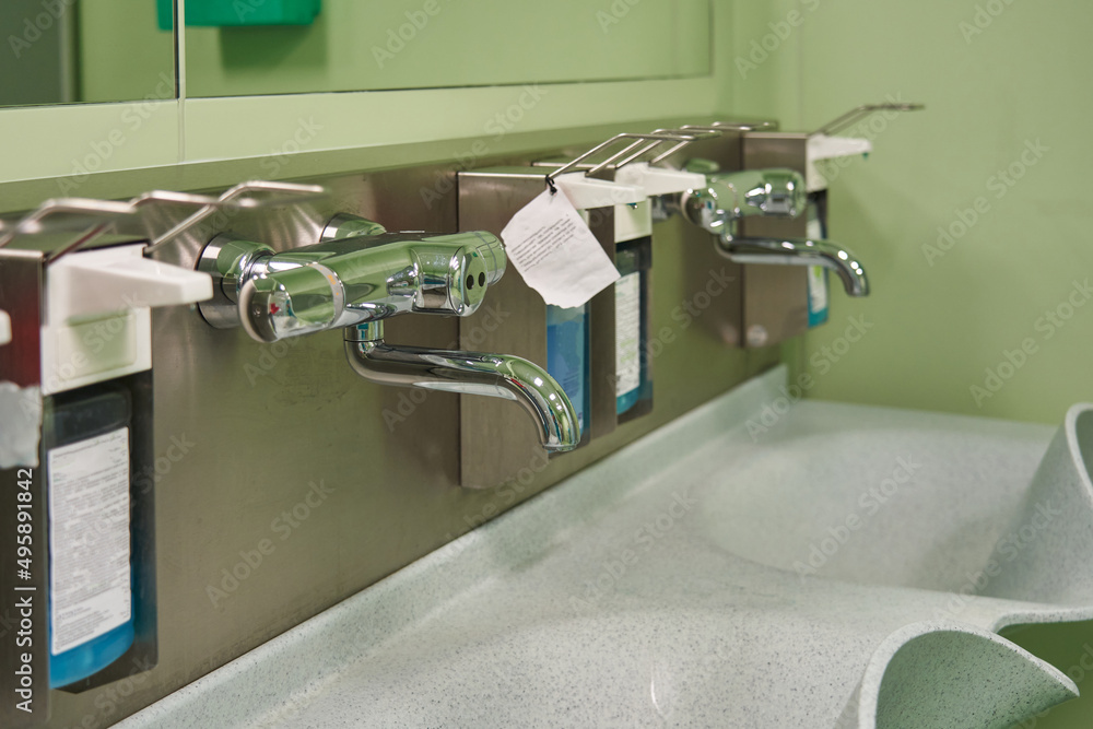 sinks in operating room with disinfectant soap to disinfect hands ...