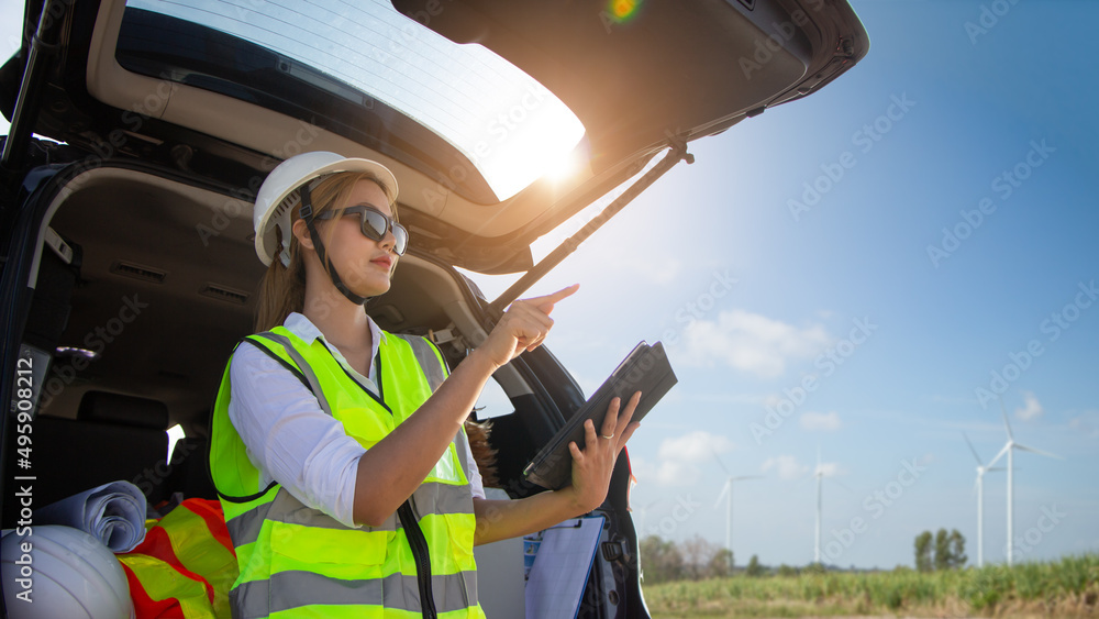 engineer team working in wind turbine farm. Renewable energy with wind ...