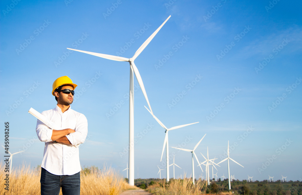 engineer team working in wind turbine farm. Renewable energy with wind ...