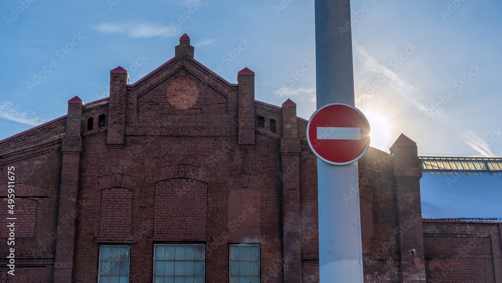No entry sign in an old town with lens flare. Red no entry traffic sign ...