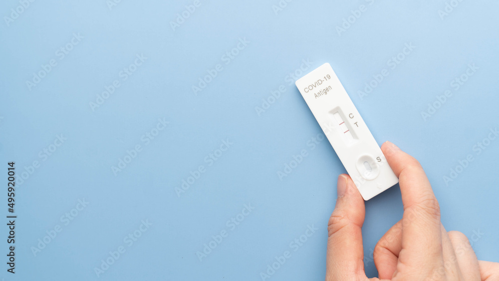 Woman hands holding SARS CoV-2 Rapid Antigen Test kit (ATK) with ...