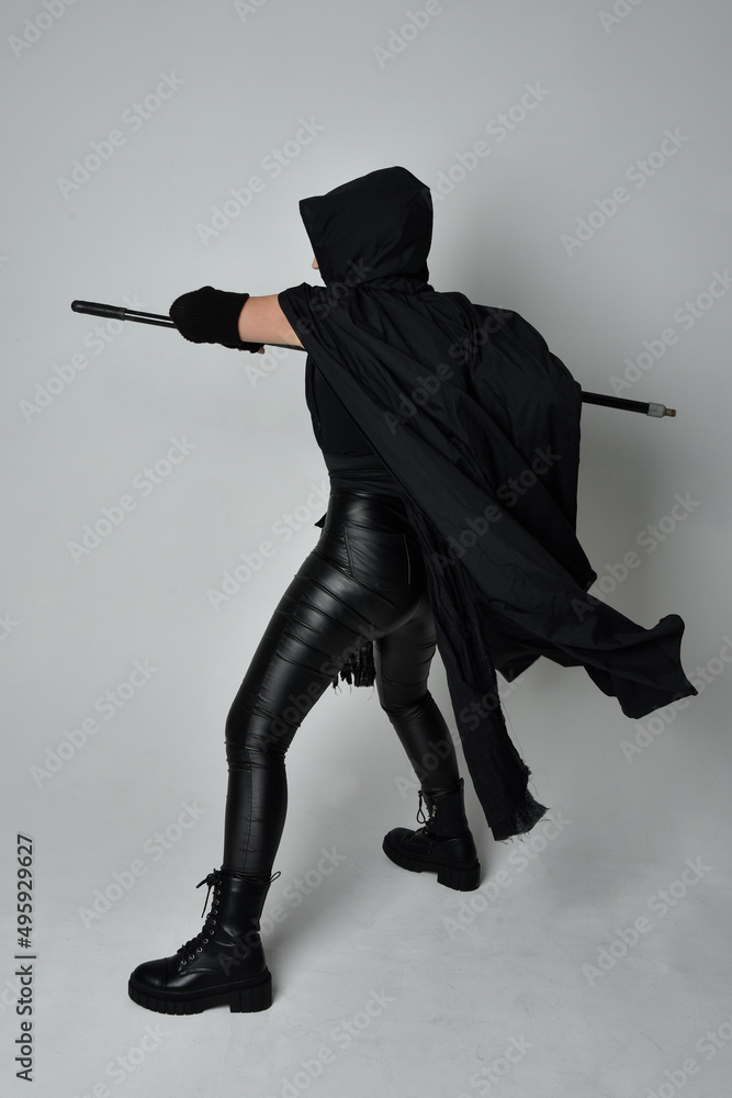 Full length portrait of pretty redhead female model wearing black ...