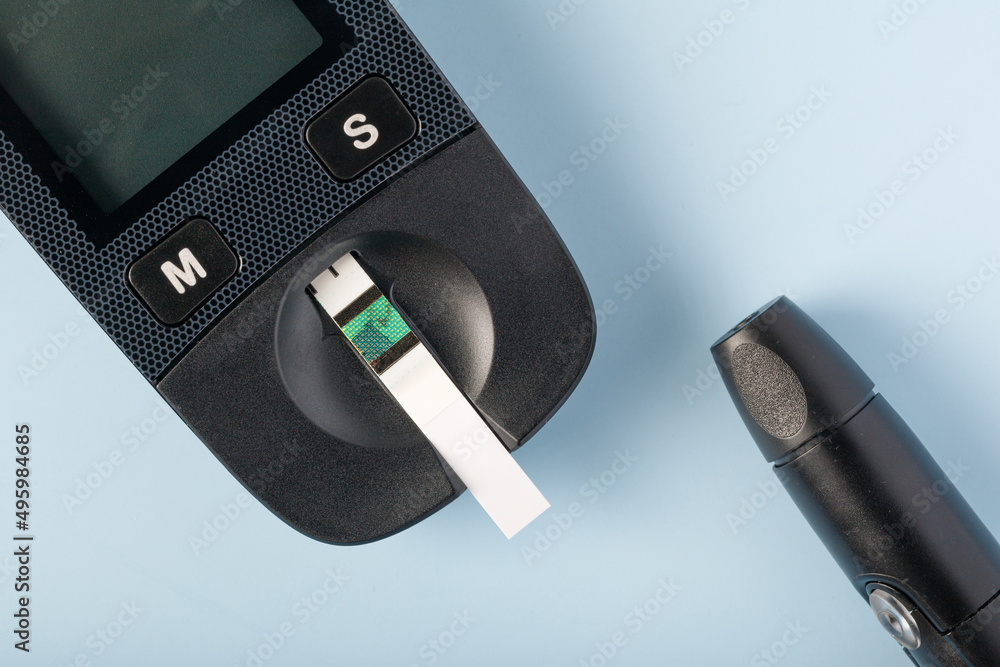 Using blood glucose meter, checking blood sugar level. glucometer ...