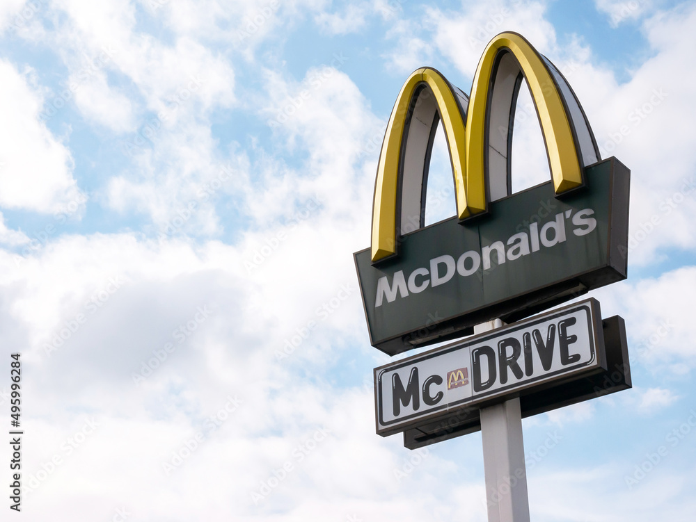McDonald's Mc Drive brand logo sign, signage detail closeup, cloudy sky ...