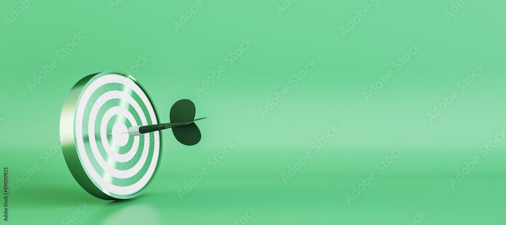 Wide bullseye target with arrow on green background with mock up place ...