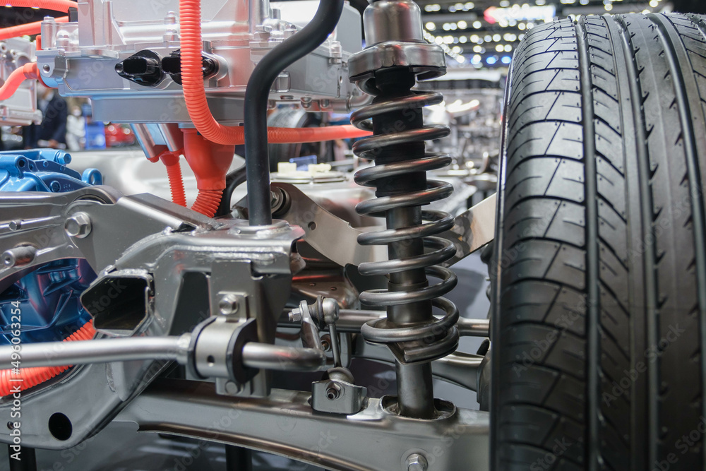 Undercarriage parts of a car, showing materials, wheels, shocks ...