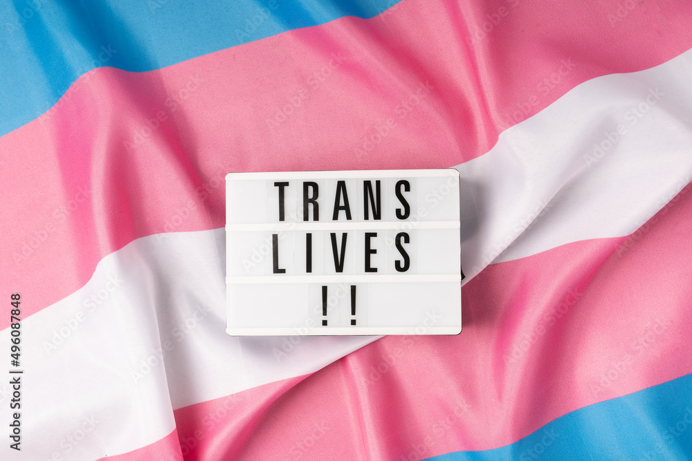 sign with Lgtbiqsign with message trans lives on pink white and blue ...